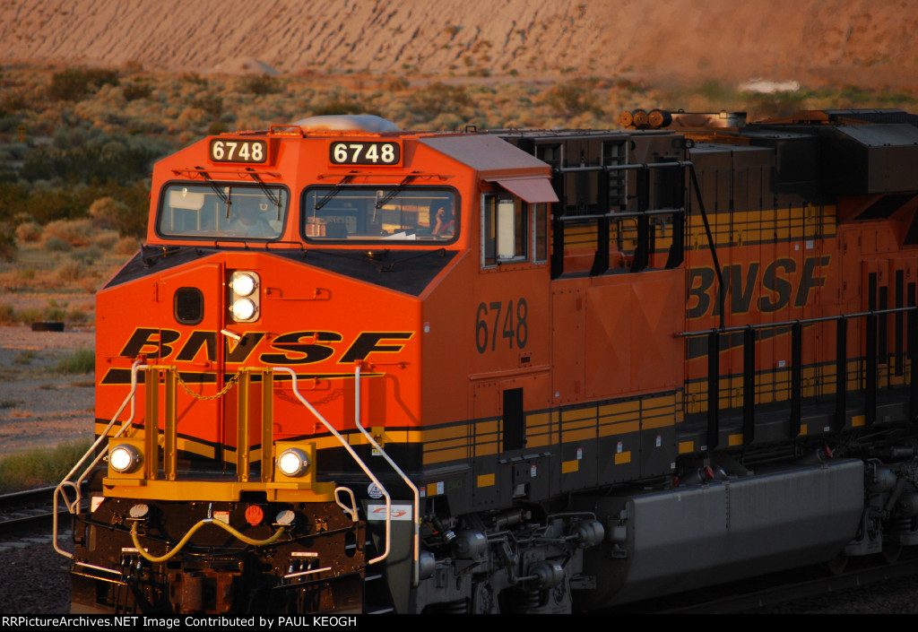 Close in shot of the cab of BNSF 6748 as she heads west with a Hot Z for LA.